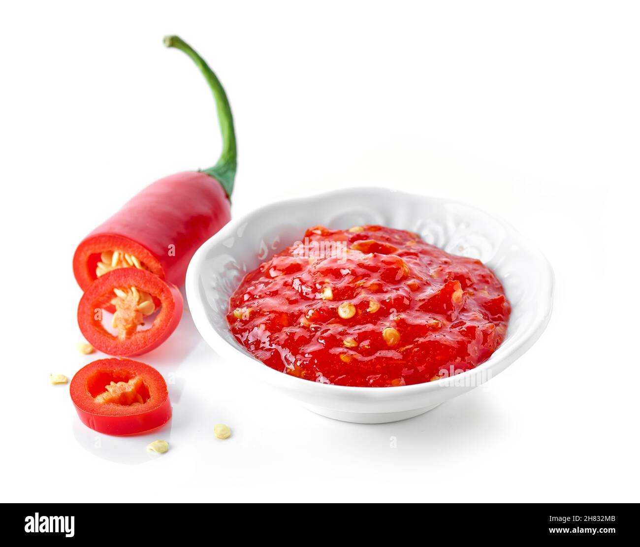 bowl of red hot chili pepper sauce isolated on white background Stock ...