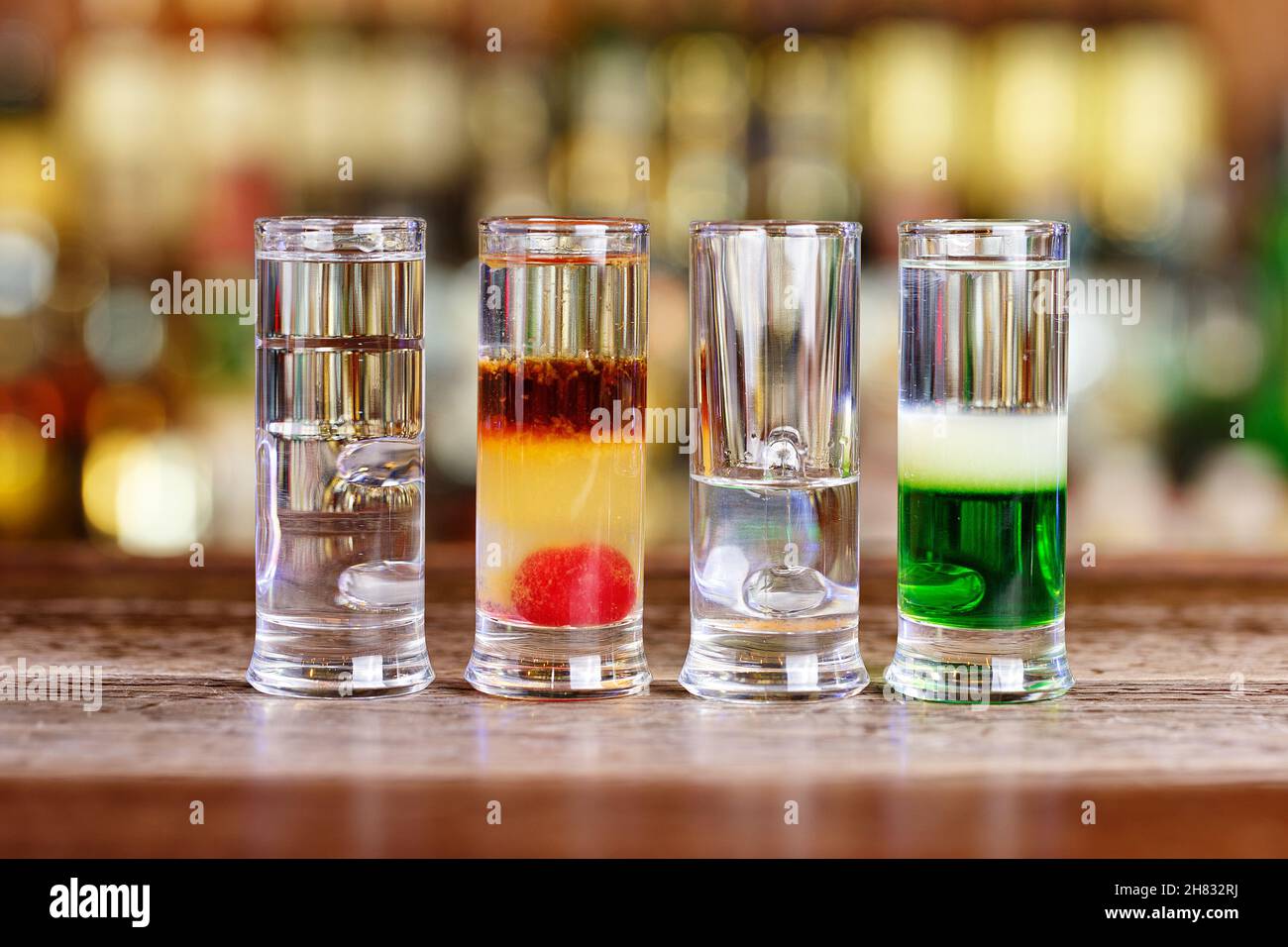 Many colorful cocktails on the bar in a nightclub or in a restaurant ...