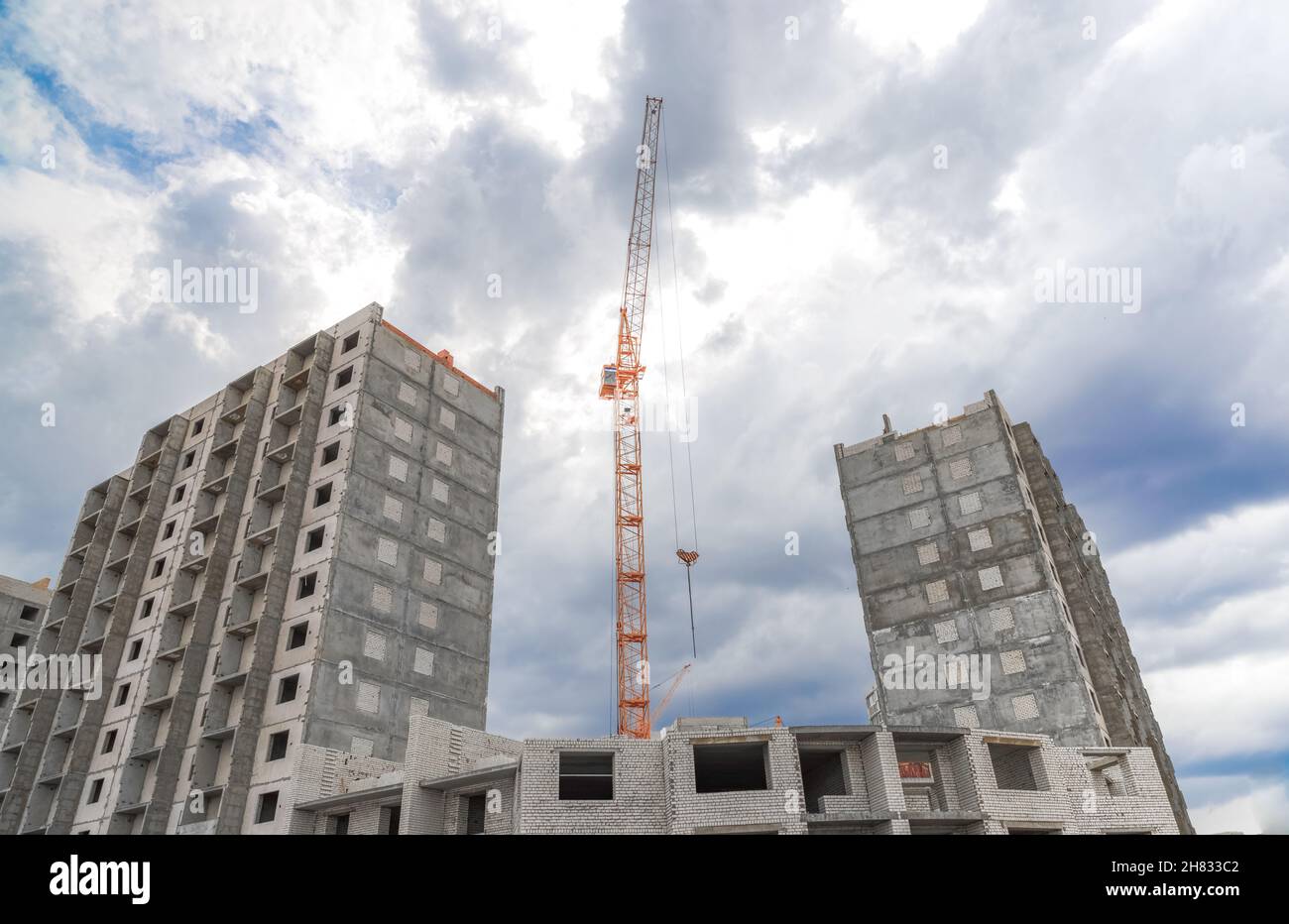 Housing development and hoist crane Stock Photo - Alamy