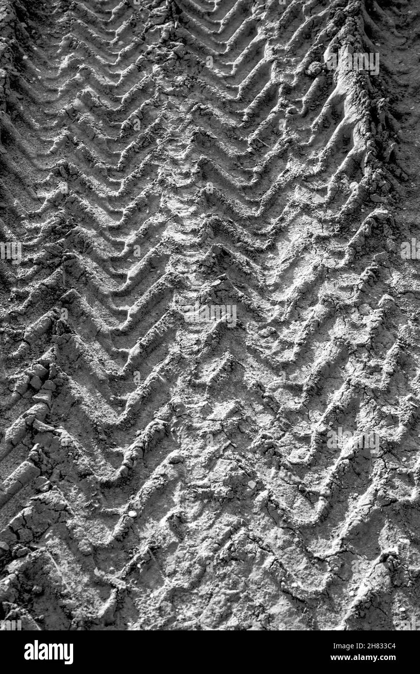 Car tyre dirt tracks on road Black and White Stock Photos & Images - Alamy