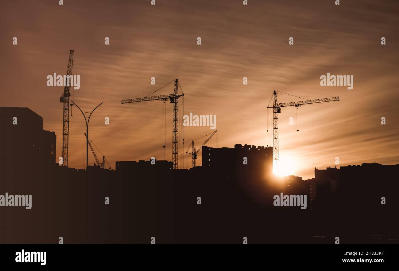 Construction site with a sunset background Stock Photo - Alamy