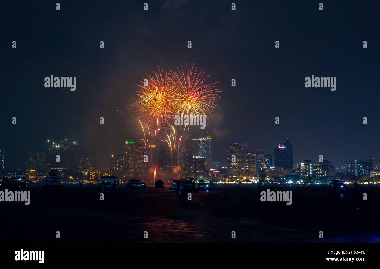 fantastic and colorful fireworks display over the night sky of the city ...