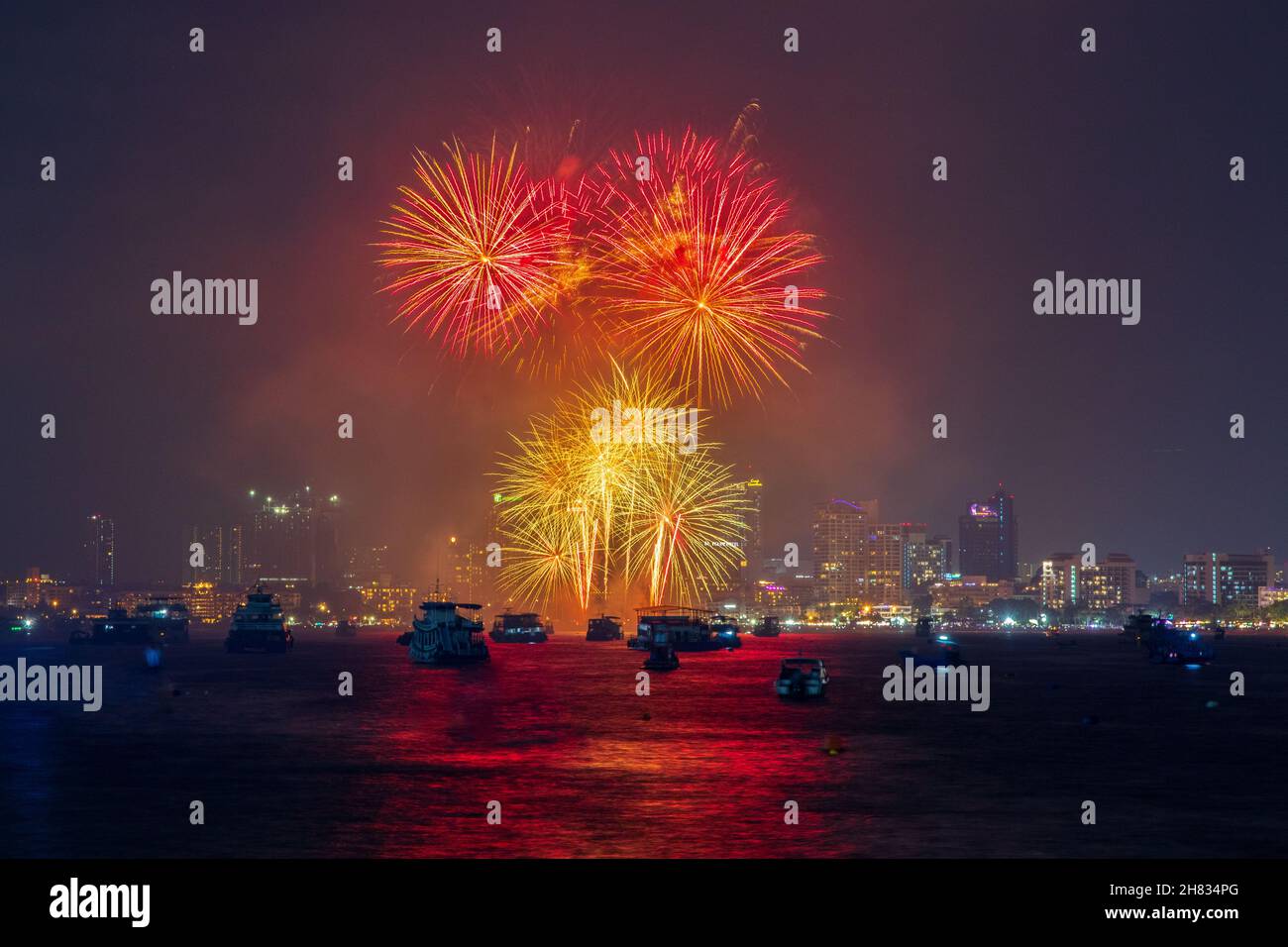 fantastic and colorful fireworks display over the night sky of the city ...