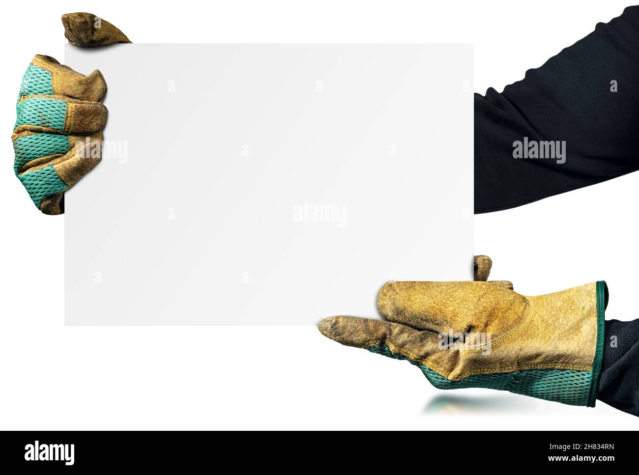 Manual worker with protective work gloves holding a blank banner ...