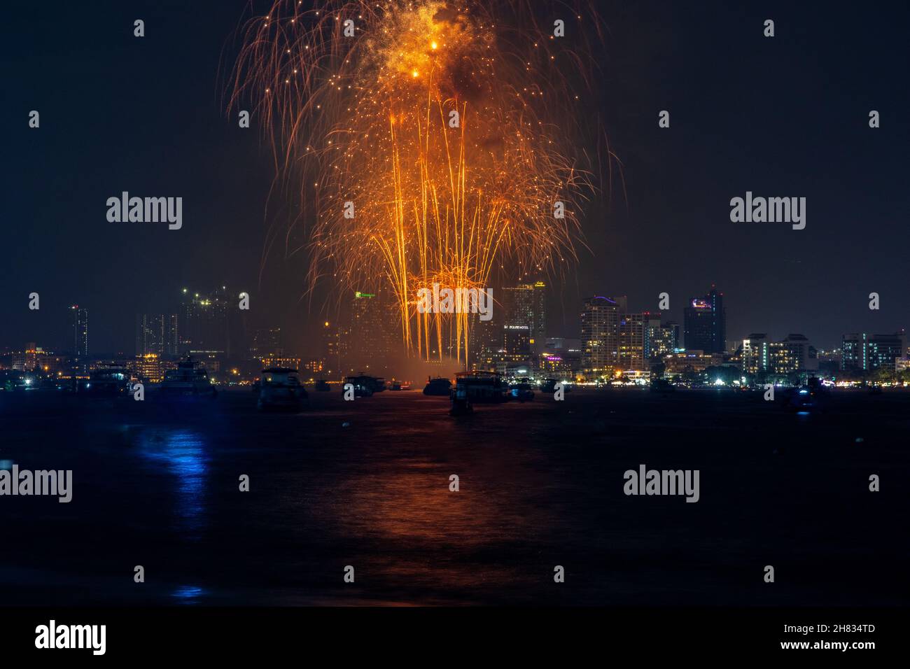 fantastic and colorful fireworks display over the night sky of the city ...