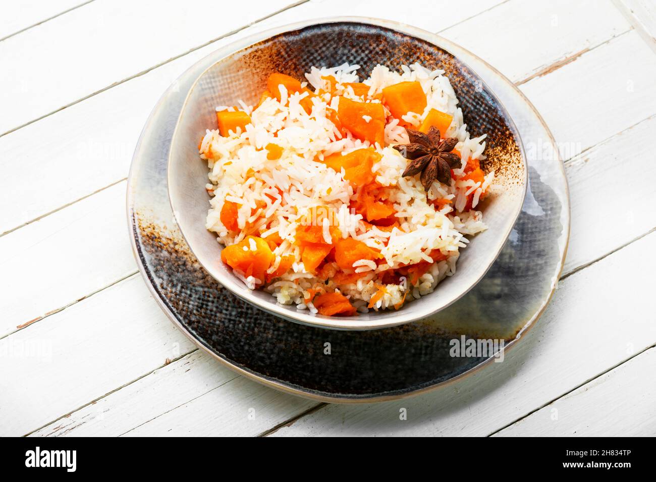 Rice with fragrant and juicy pumpkin. Vegetable pilaf Stock Photo - Alamy
