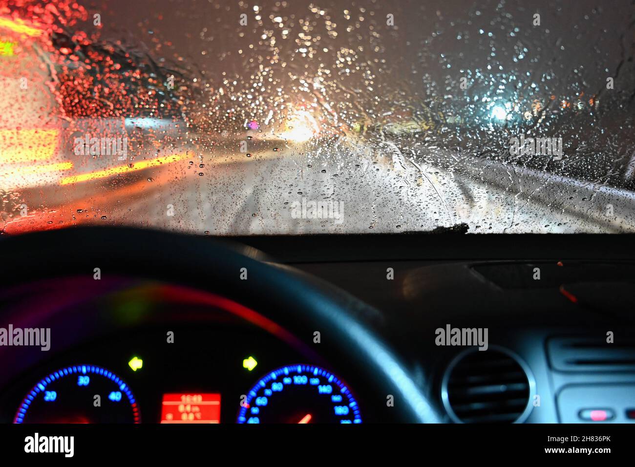 Dangerous winter season with snow on the road. The interior of the car ...