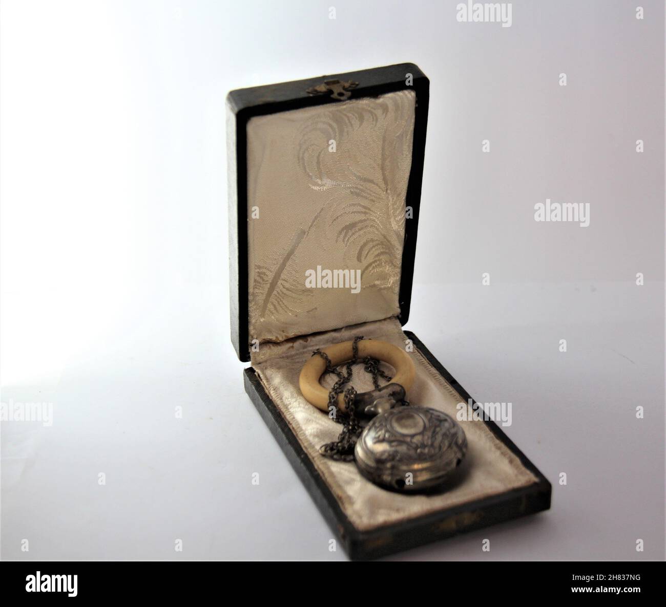 Antique rattle, for babies, year 1925, in silver, in box Stock Photo ...