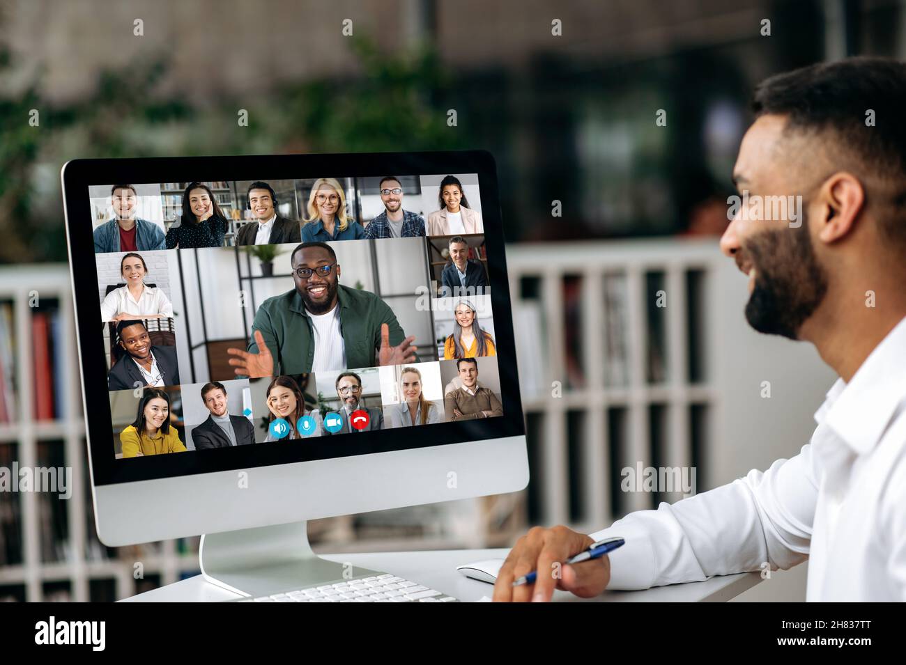 Online conversation by video conference. Successful Indian business man ...