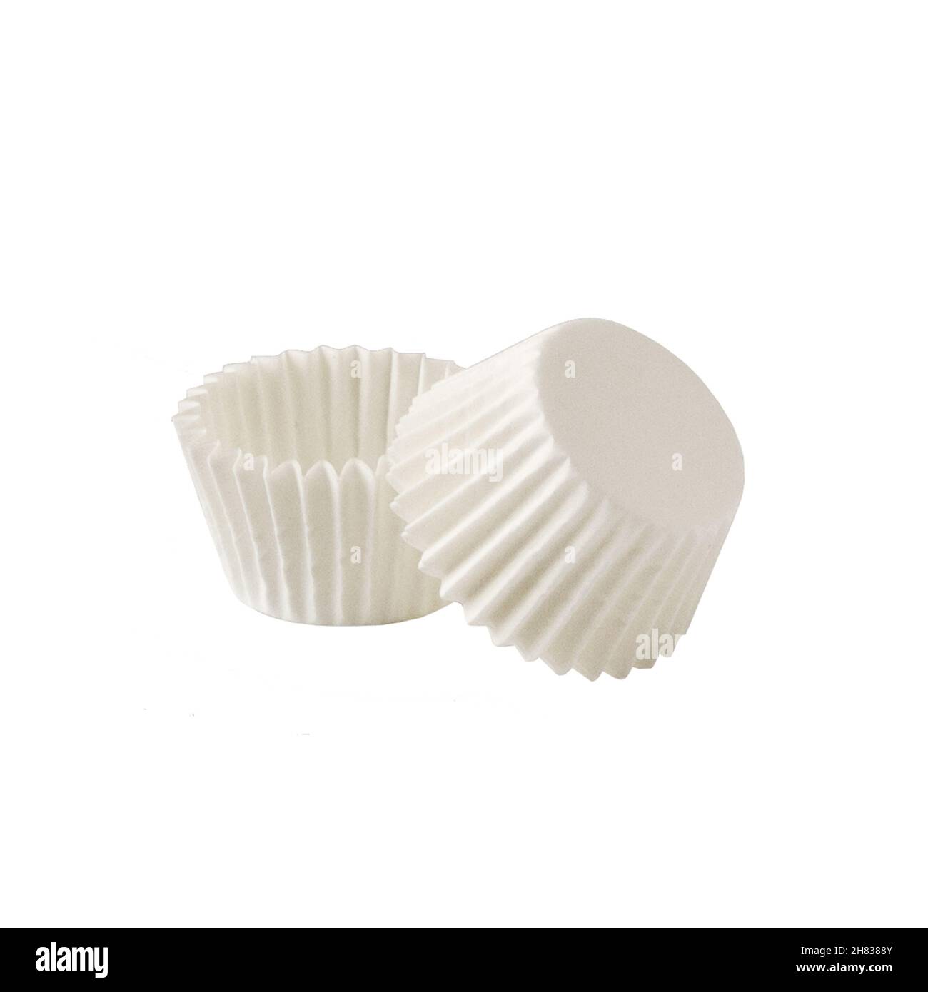 White paper baking forms for muffins isolated over white background ...
