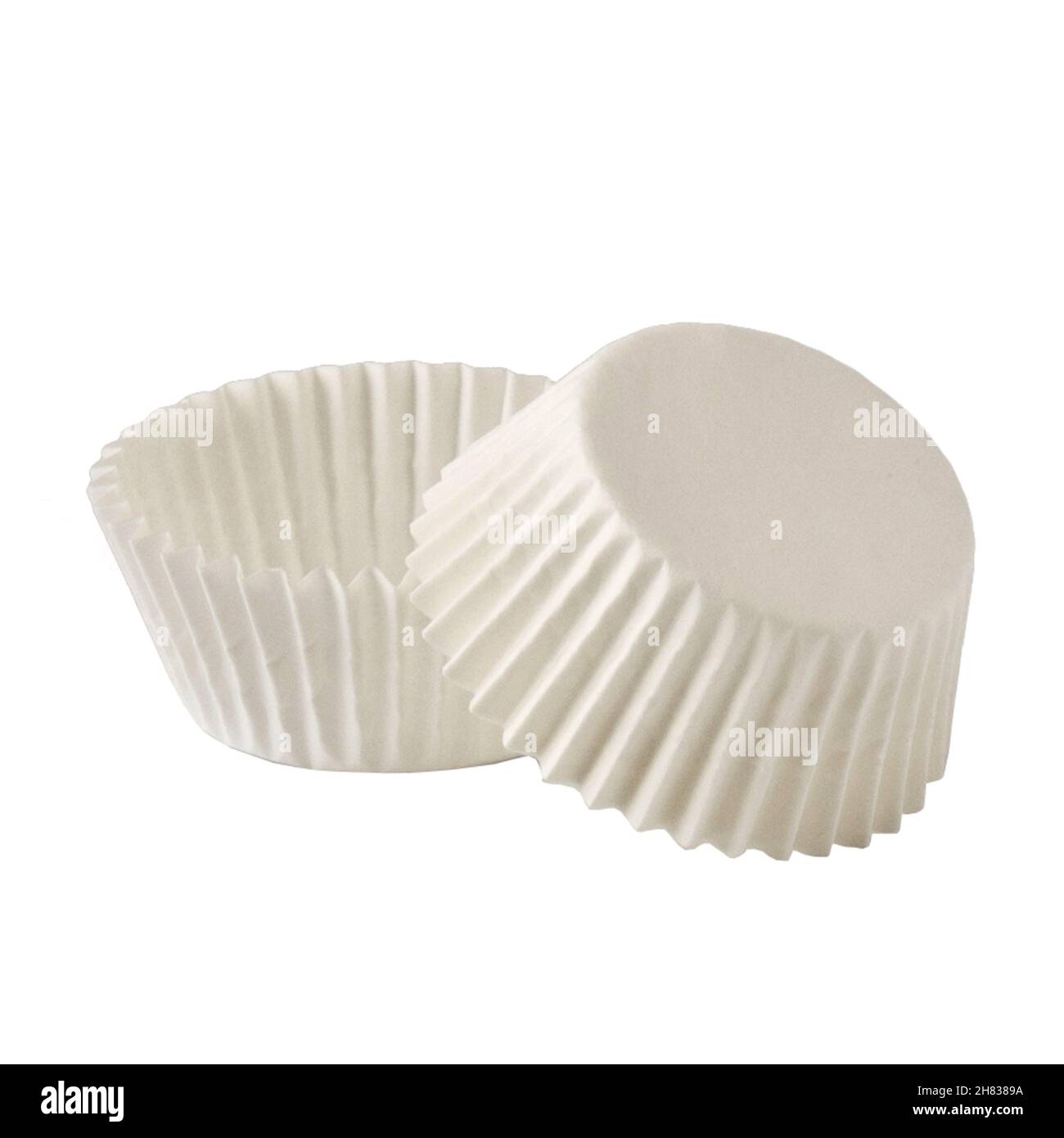 White paper baking forms for muffins isolated over white background ...