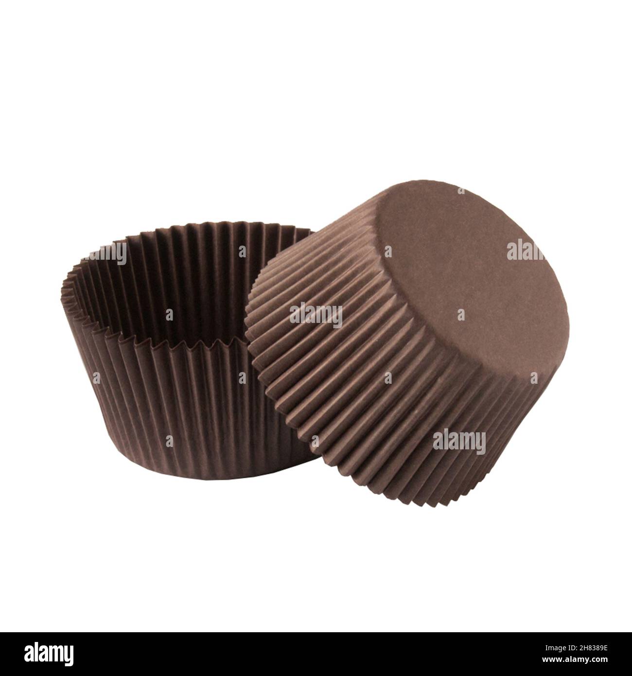 Brown paper baking forms for muffins isolated over white background ...