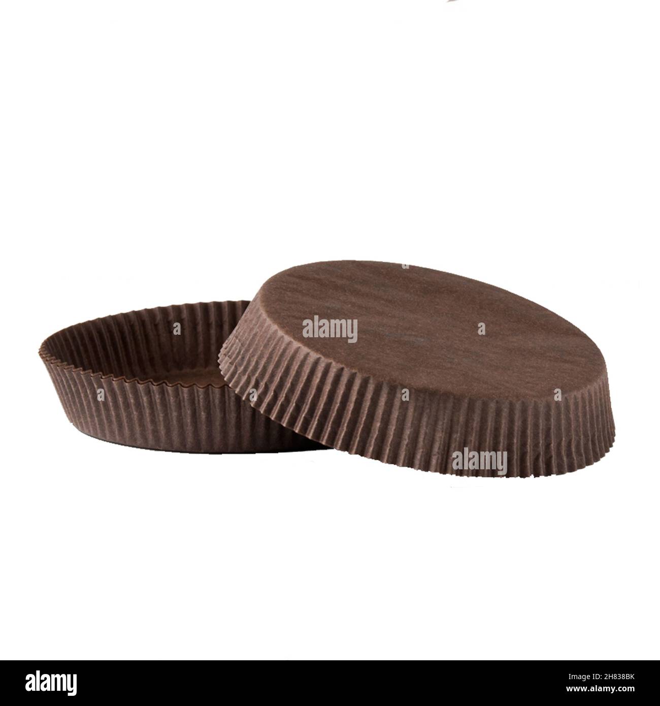 Flat paper baking form for cakes and bread isolated over white ...