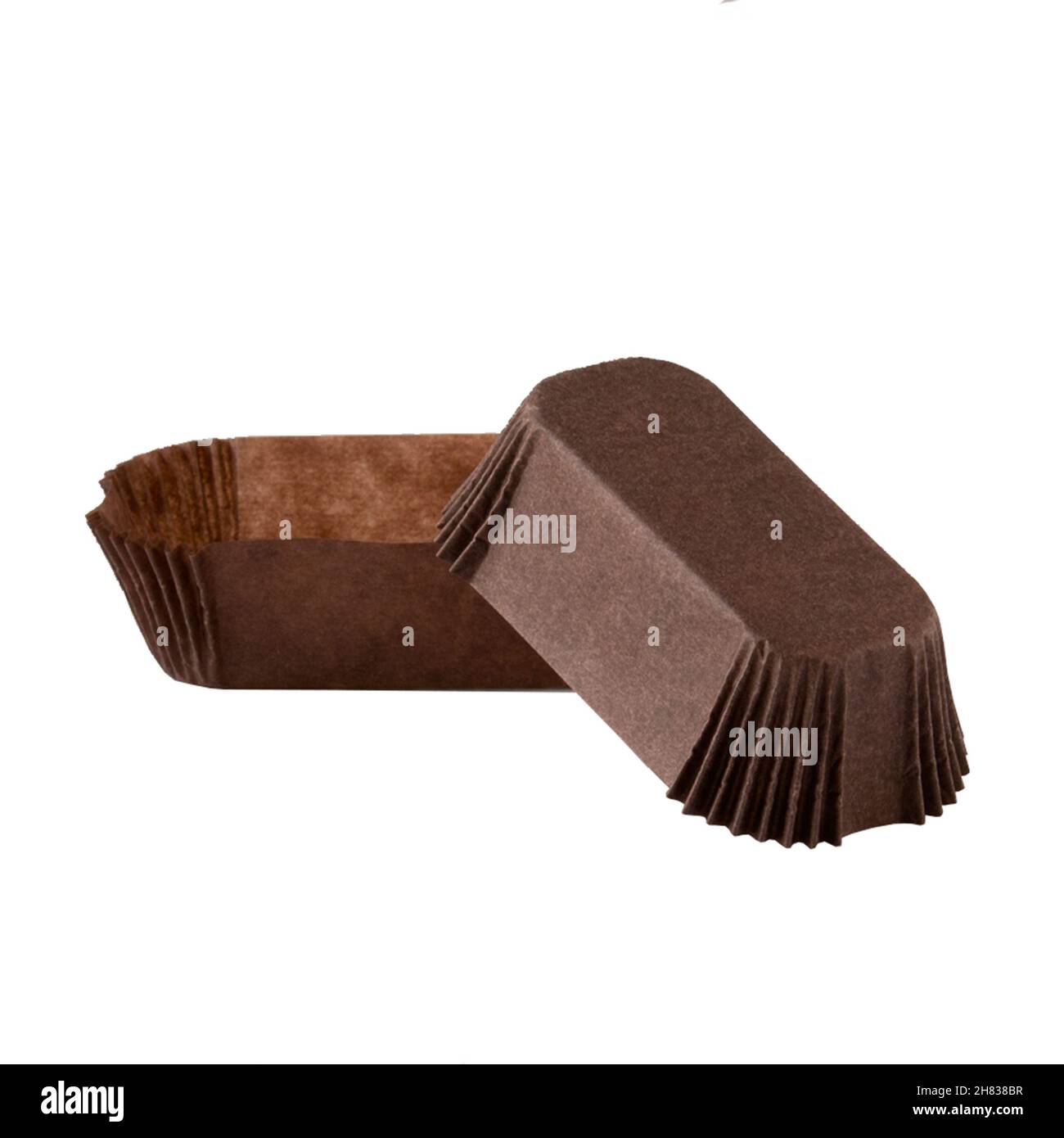 Paper baking form for cakes and bread isolated over white background ...