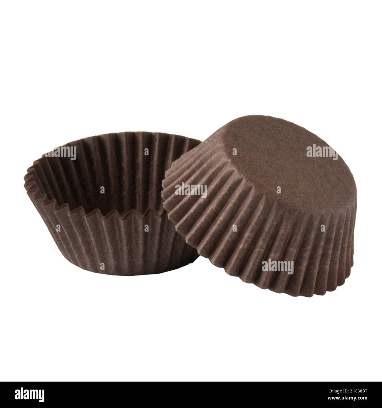Brown paper baking forms for muffins isolated over white background ...