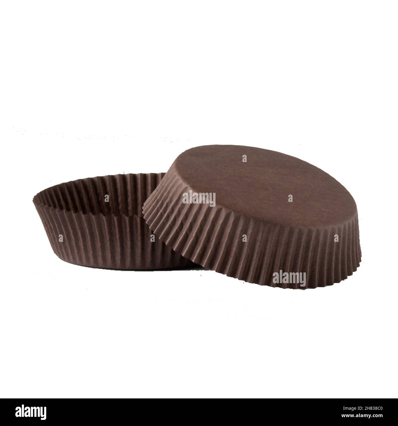 Brown paper baking forms for muffins isolated over white background ...