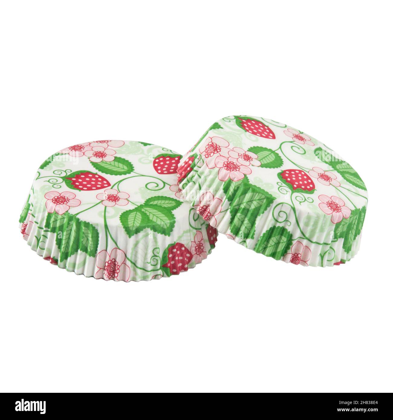 White paper baking forms for muffins and cupcakes with flowers and ...