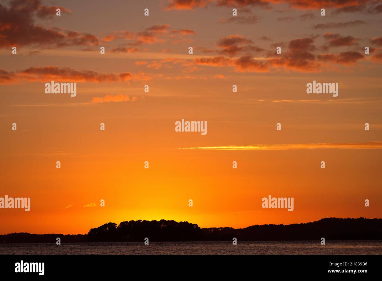 Sunset over Brownsea Island in Poole Harbour Southern England Stock ...