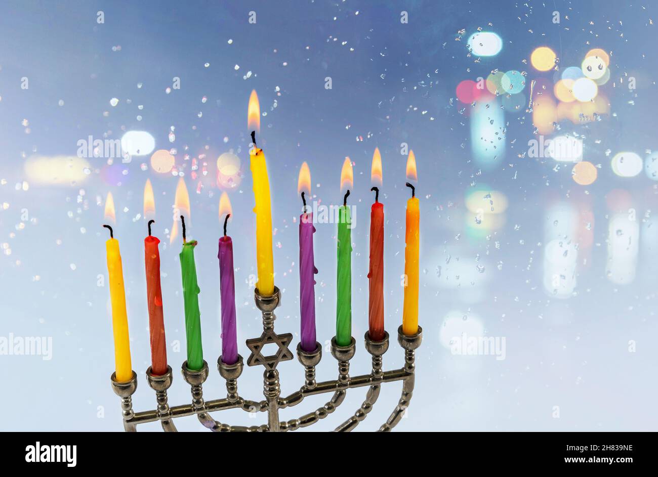 Menorah Hanukkah oil candles are burning in hanukkiah on light holiday ...