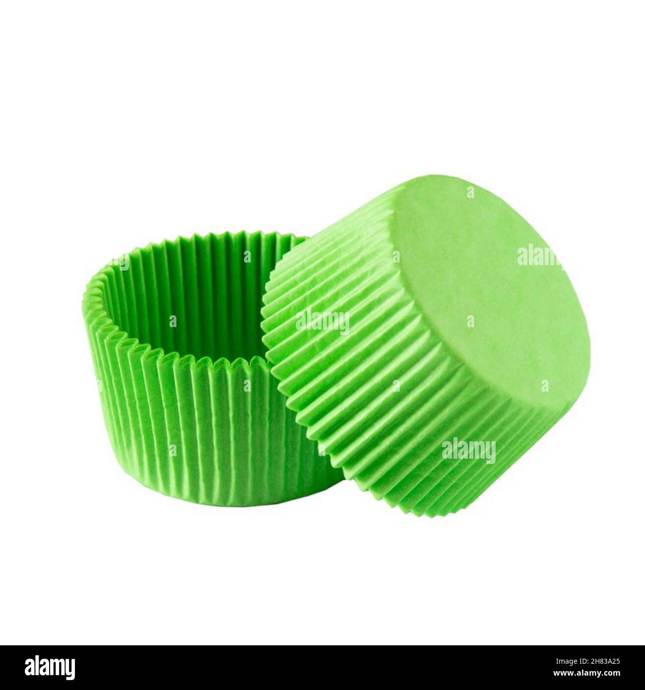 Green paper cupcake forms for baking isolated over white background ...