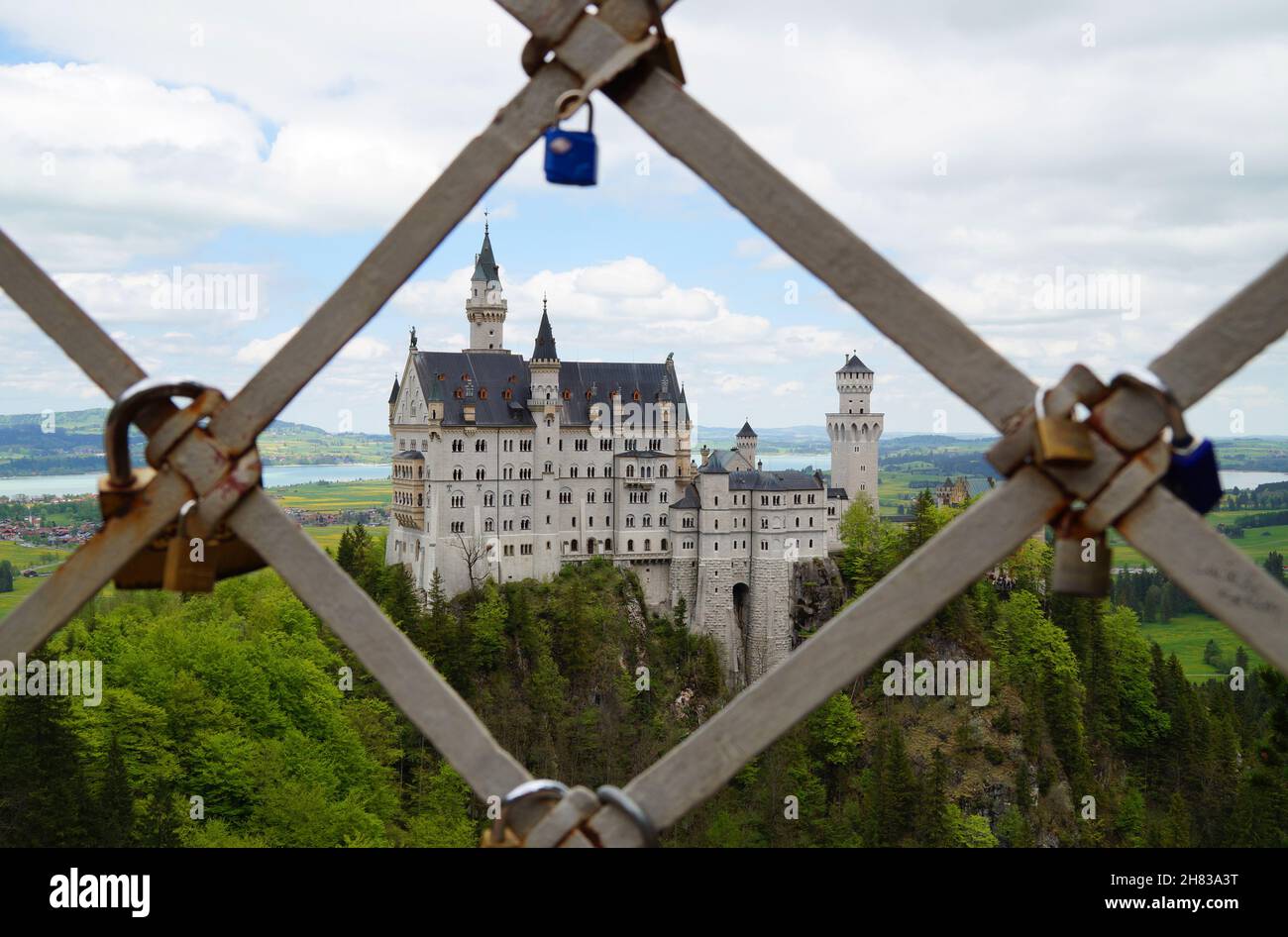 Bavarian castle Neuschwanstein in the Alps and lake Forggensee in the ...