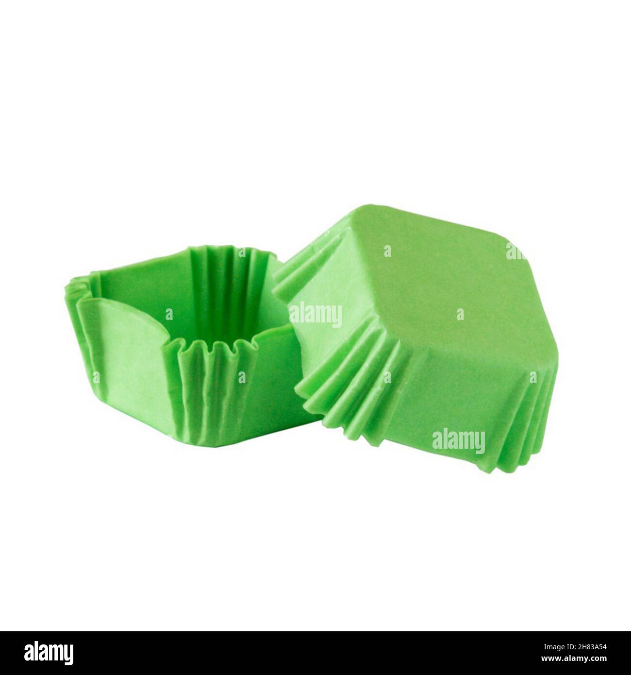 Green paper cupcake forms for baking isolated over white background ...
