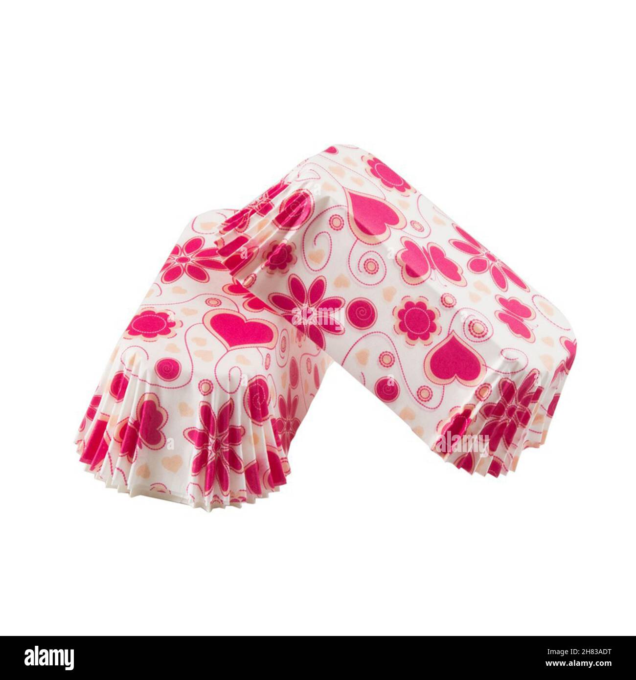 White paper baking forms for cakes with lovely hearts pattern isolated ...