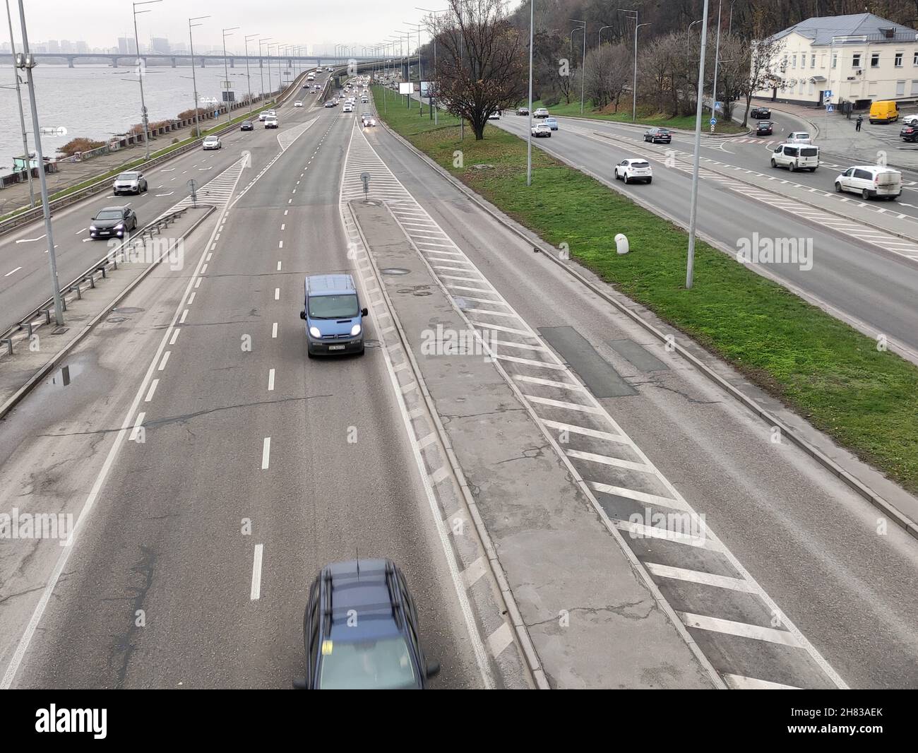 City highway traffic background, cars moving on a freeway during the ...