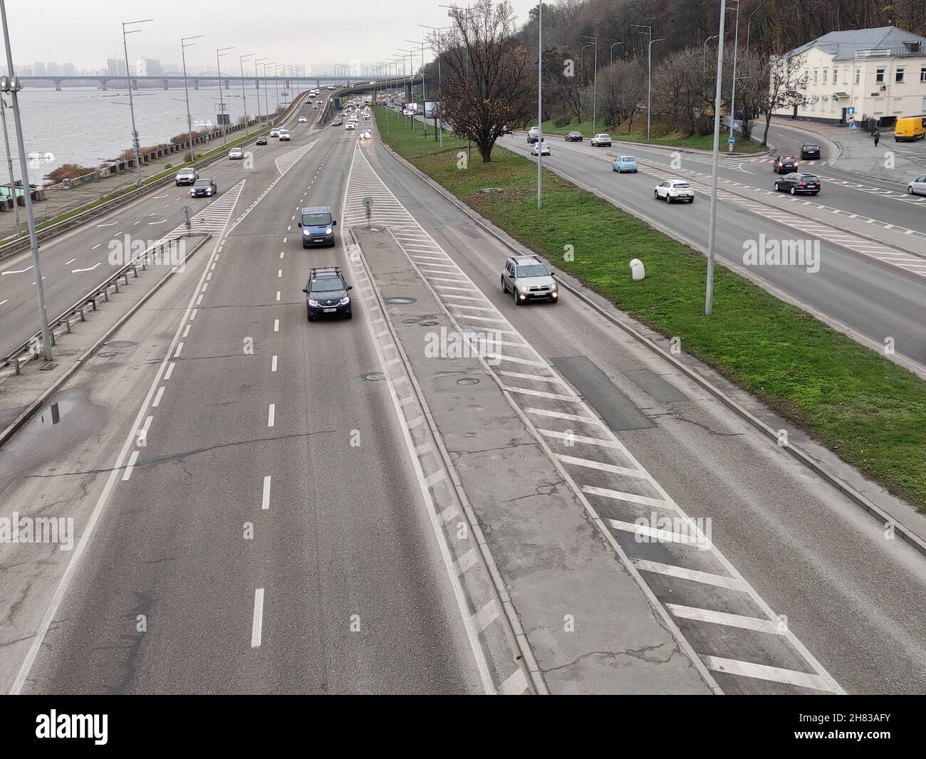City highway traffic background, cars moving on a freeway during the ...