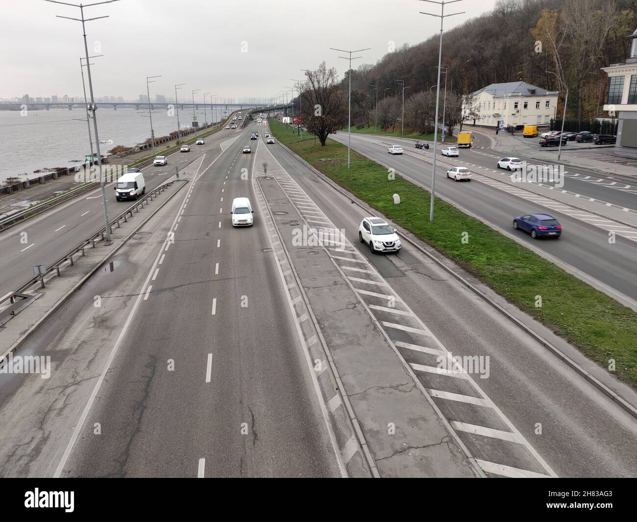 City highway traffic background, cars moving on a freeway during the ...