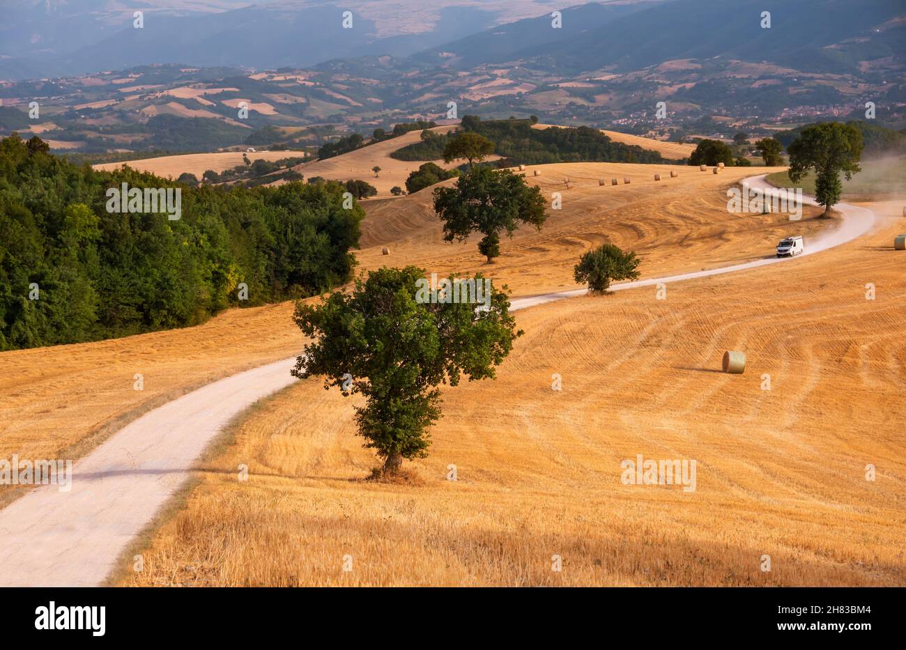 Rural landscape with winding road among farm fields in countryside ...