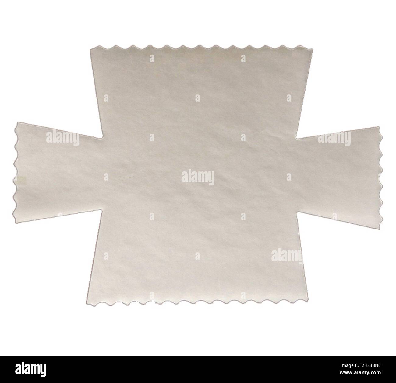 Paper confectionery napkin. White cross shaped parchment napkin ...