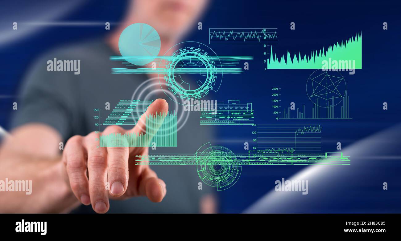 Man touching a digital analytics concept on a touch screen with his ...
