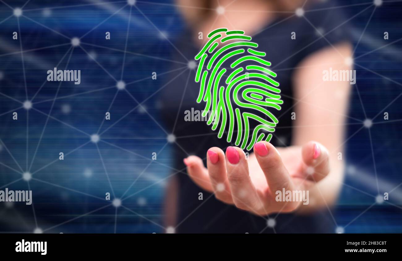 Fingerprint security system concept above the hand of a woman in ...
