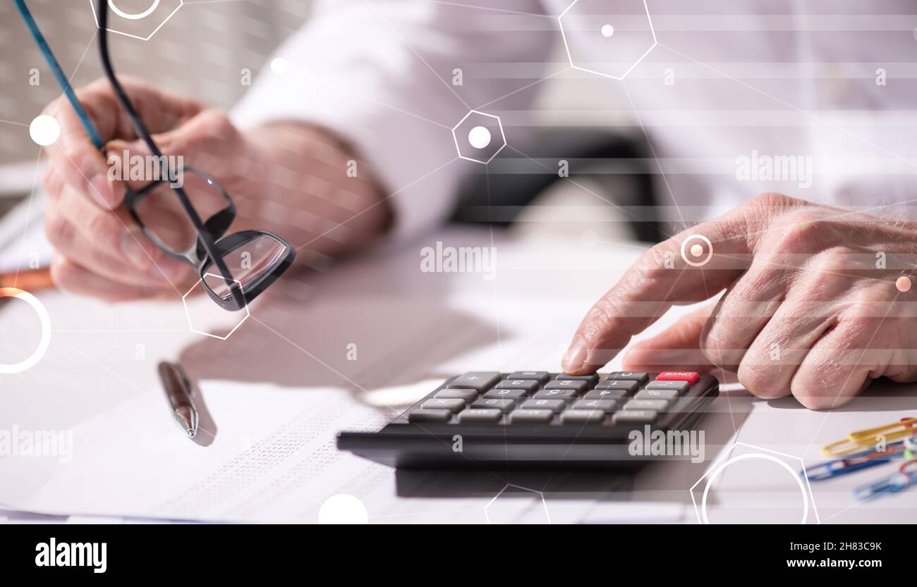 Male hand using calculator, accounting concept, light effect, overlayed ...
