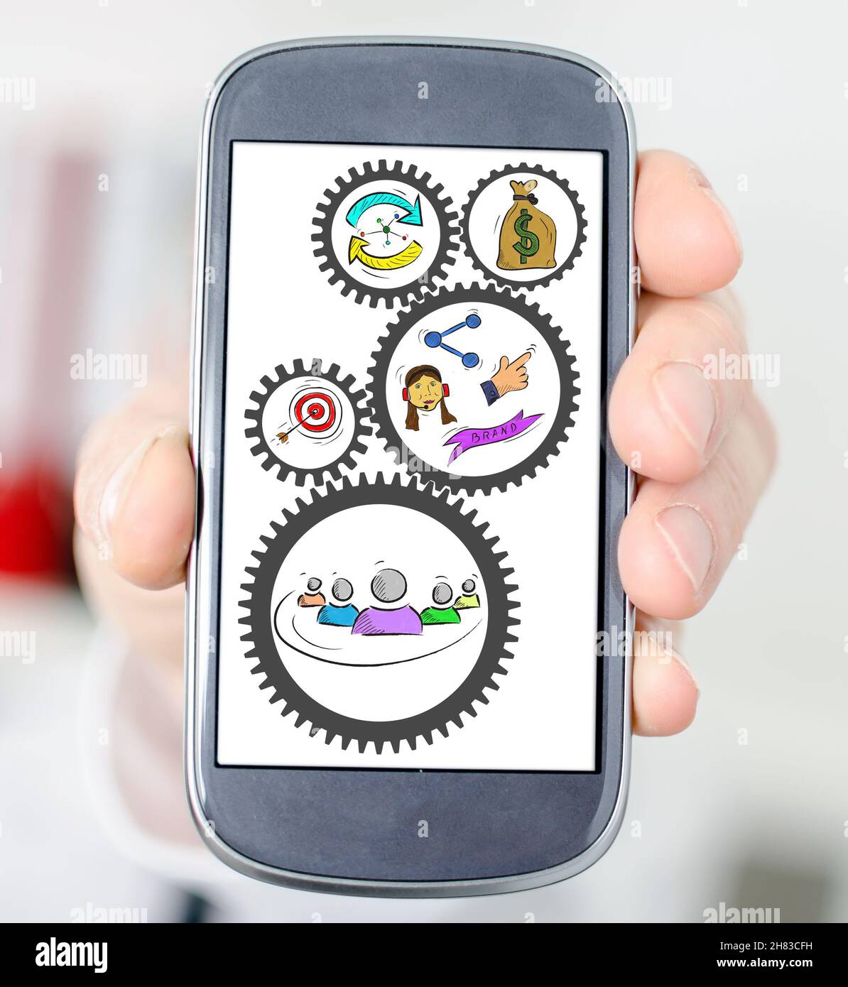 Hand holding a smartphone with business strategy concept Stock Photo ...