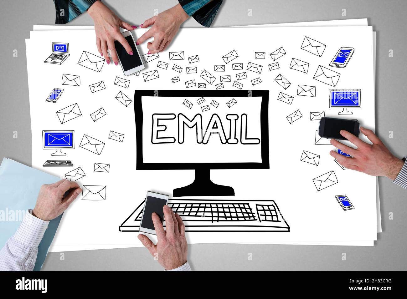 Email concept placed on a desk with hands using smartphones Stock Photo ...