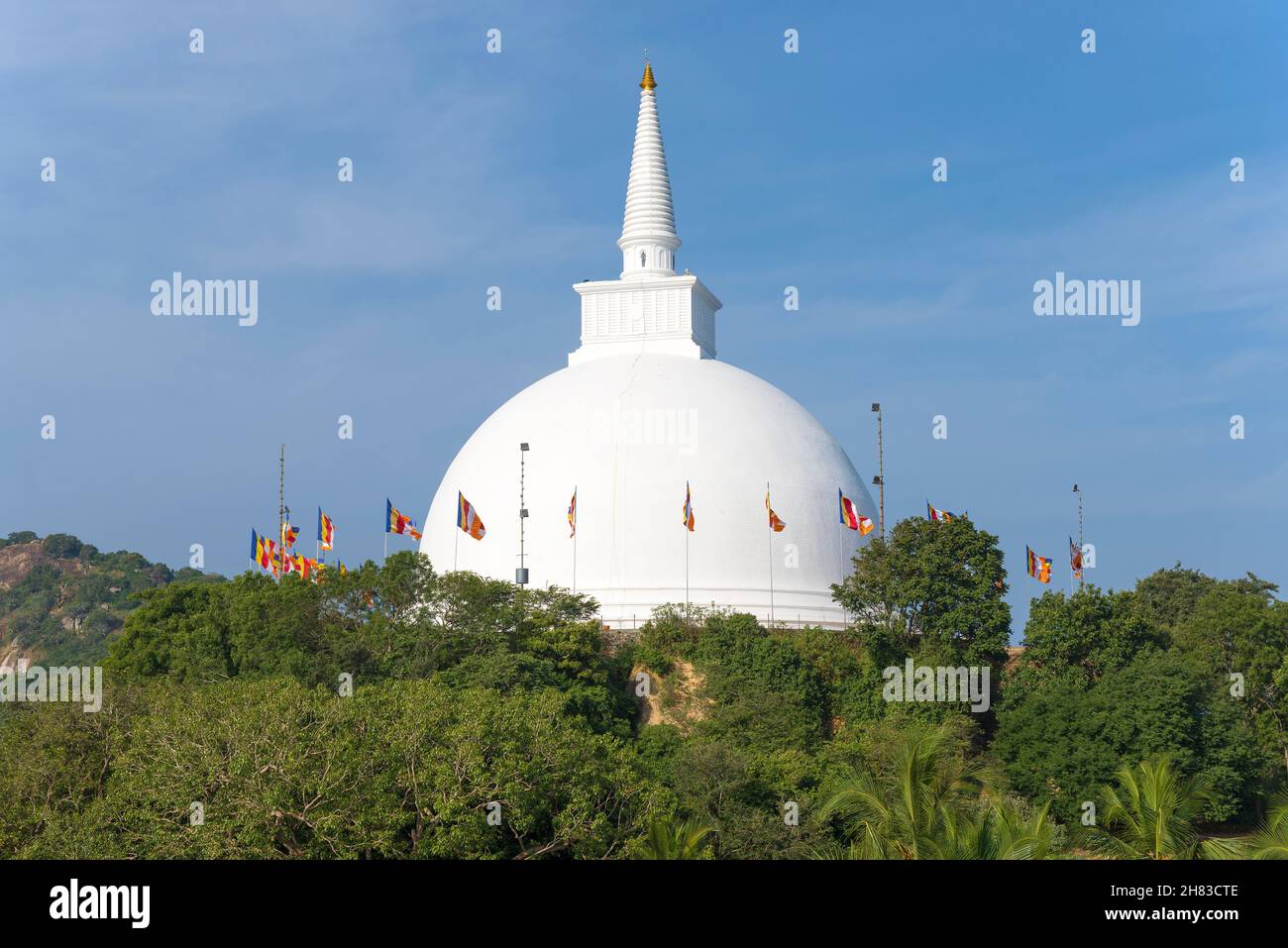 Ancient Buddhist stupa of Mahaseya Dagoba against the blue sky ...