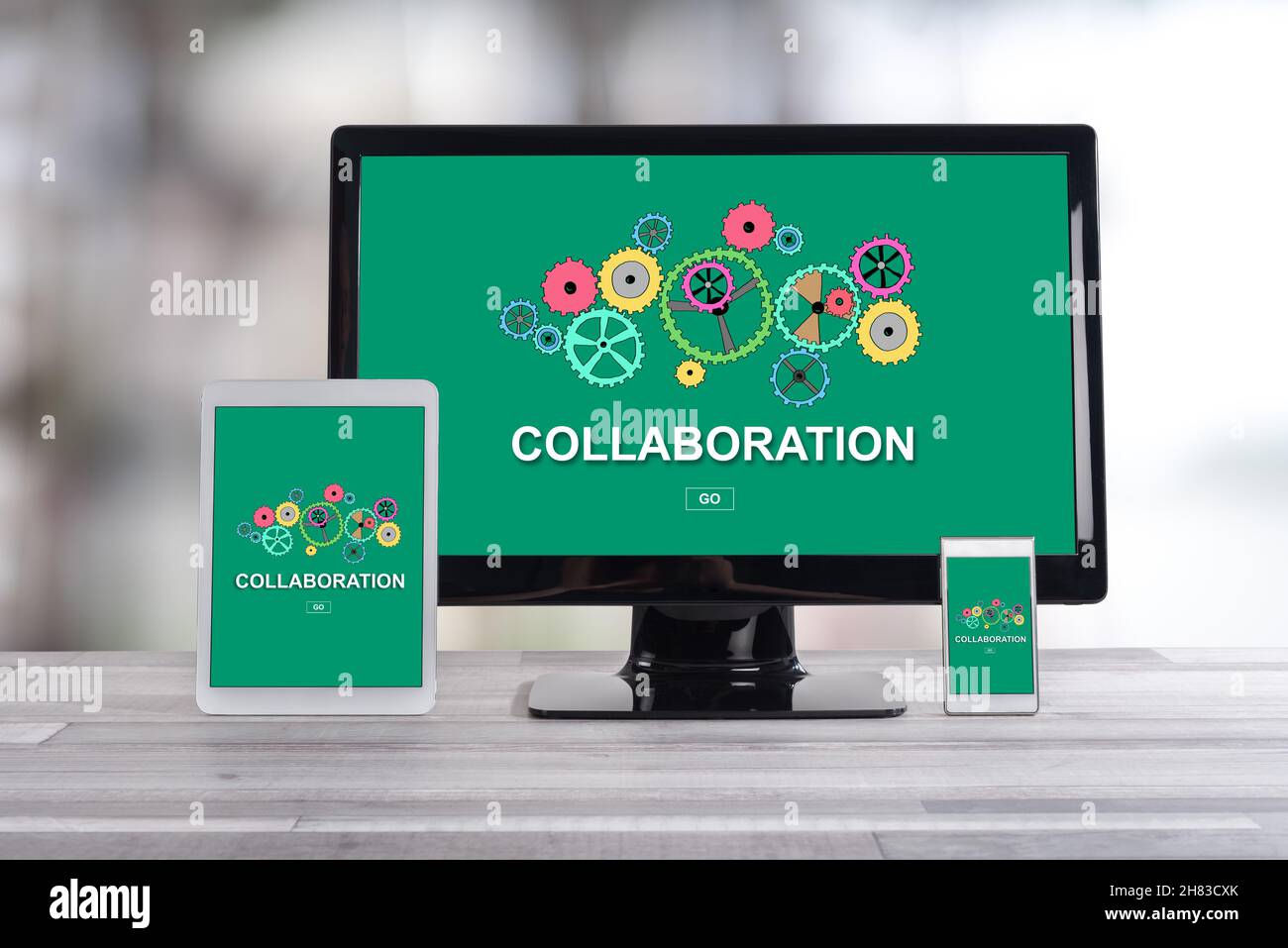 Collaboration concept shown on different information technology devices ...