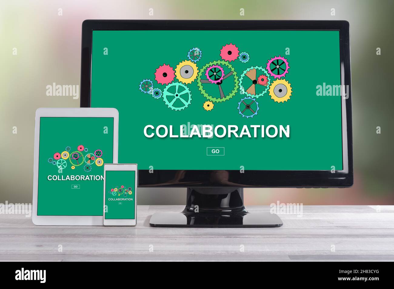 Collaboration concept shown on different information technology devices ...