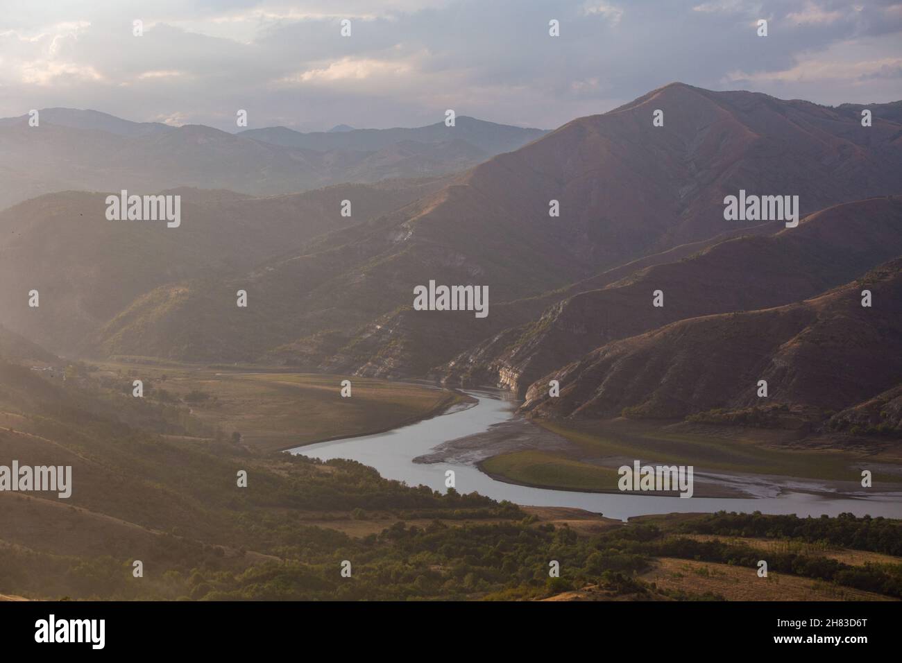 Long exposure shot of rocky landscapes with a river underneath Stock ...