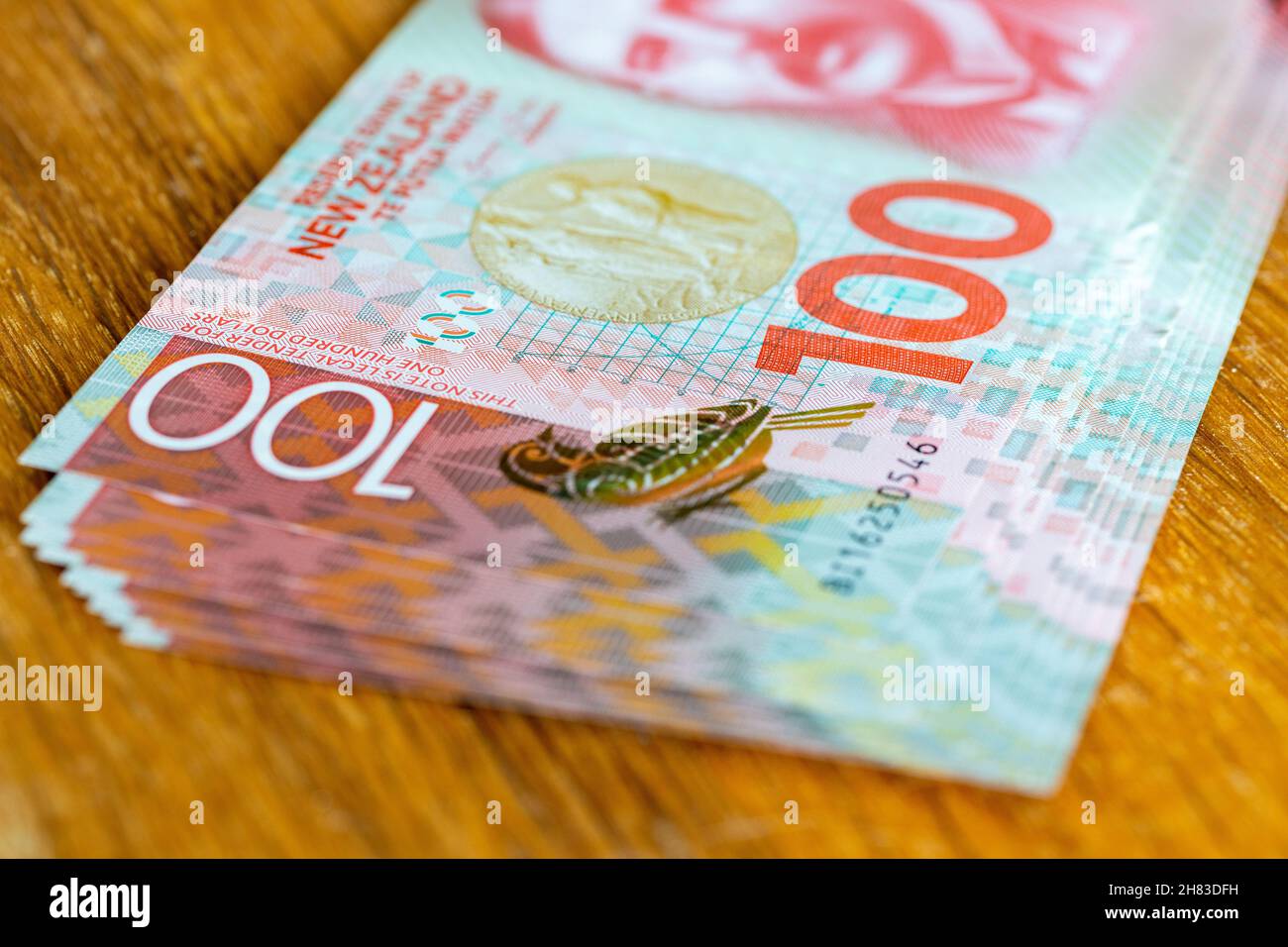New Zealand money, Lying on the table a file of banknotes of 100 ...