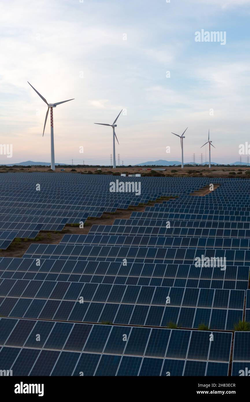 Solar panels and wind turbines producing green energy for clean ...