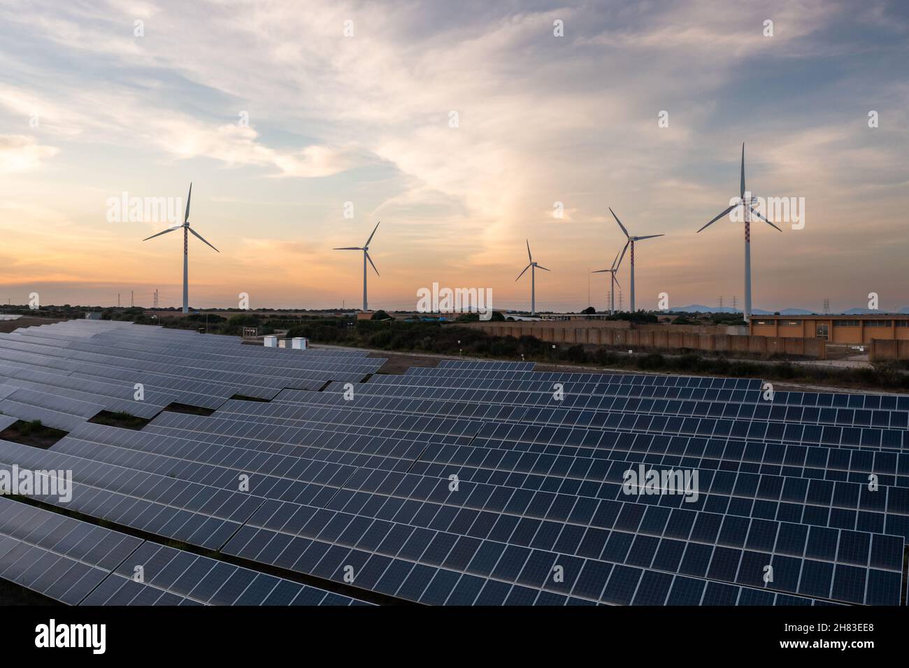 Solar panels and wind turbines producing green energy for clean ...