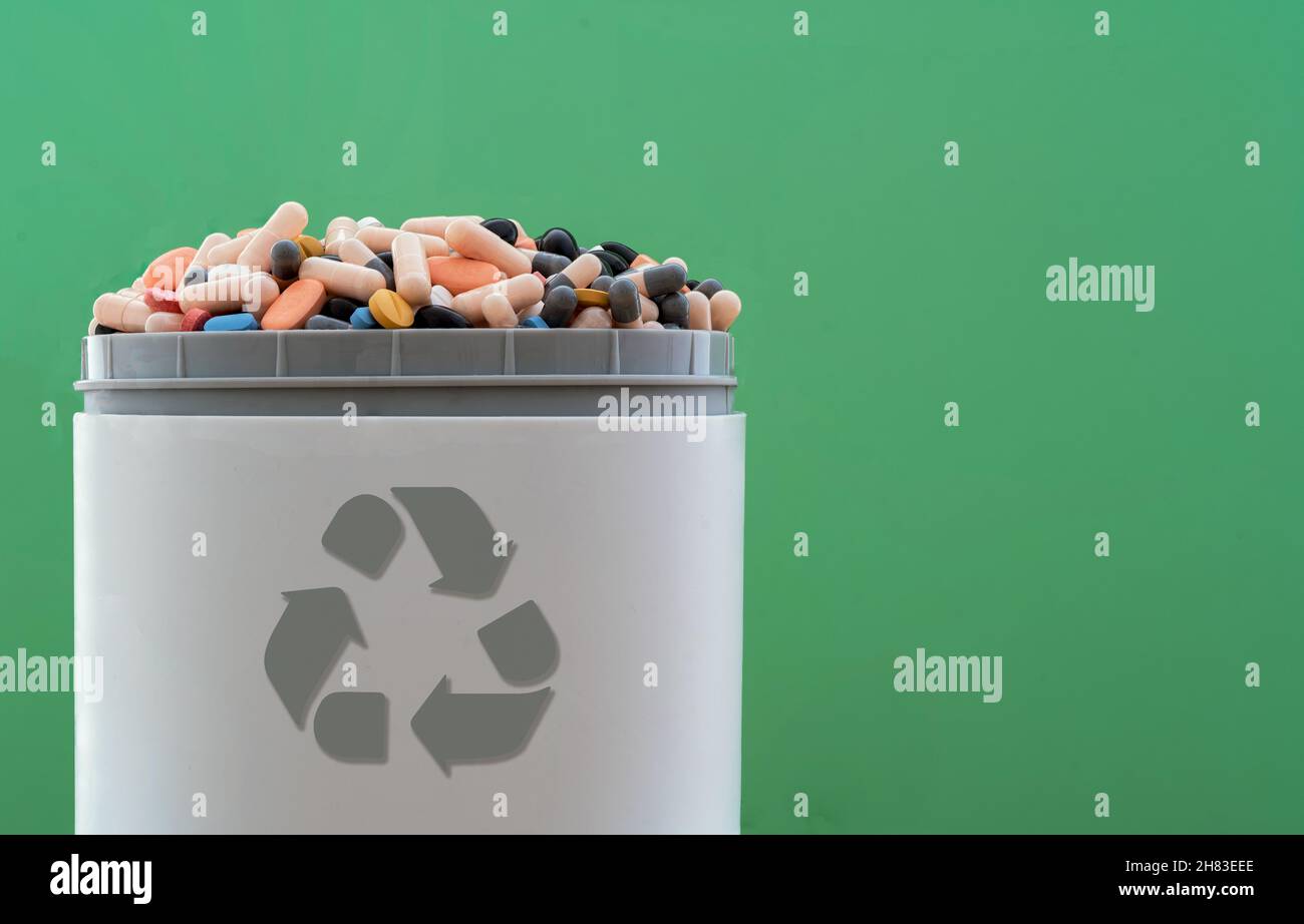 Full of expired pills and medicines in the trash bin with recycling ...