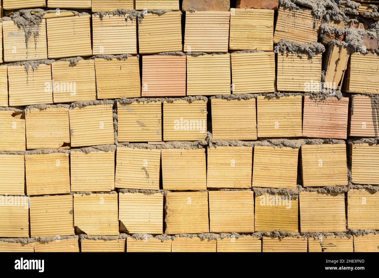 texture or pattern of a yellow break wall, rough placement of breaks ...