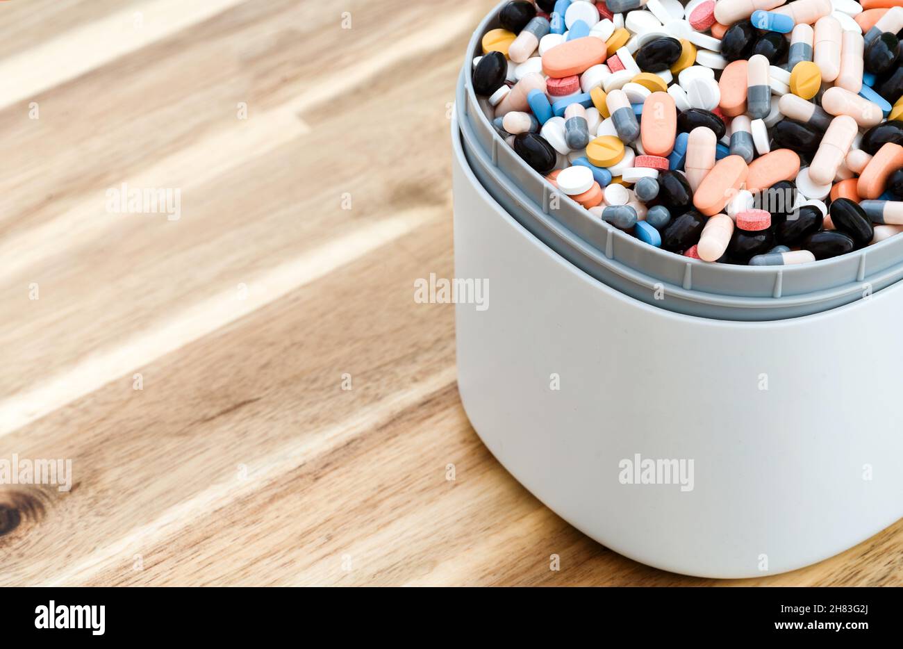 Close up photo of trash bin with full of pills and medicines. Expired ...