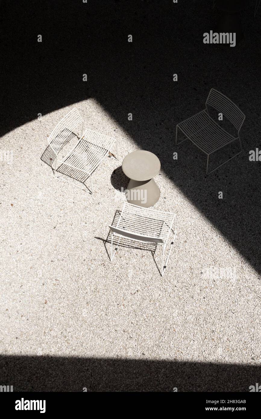 photography of outdoor interiors with modern table and benches and play ...