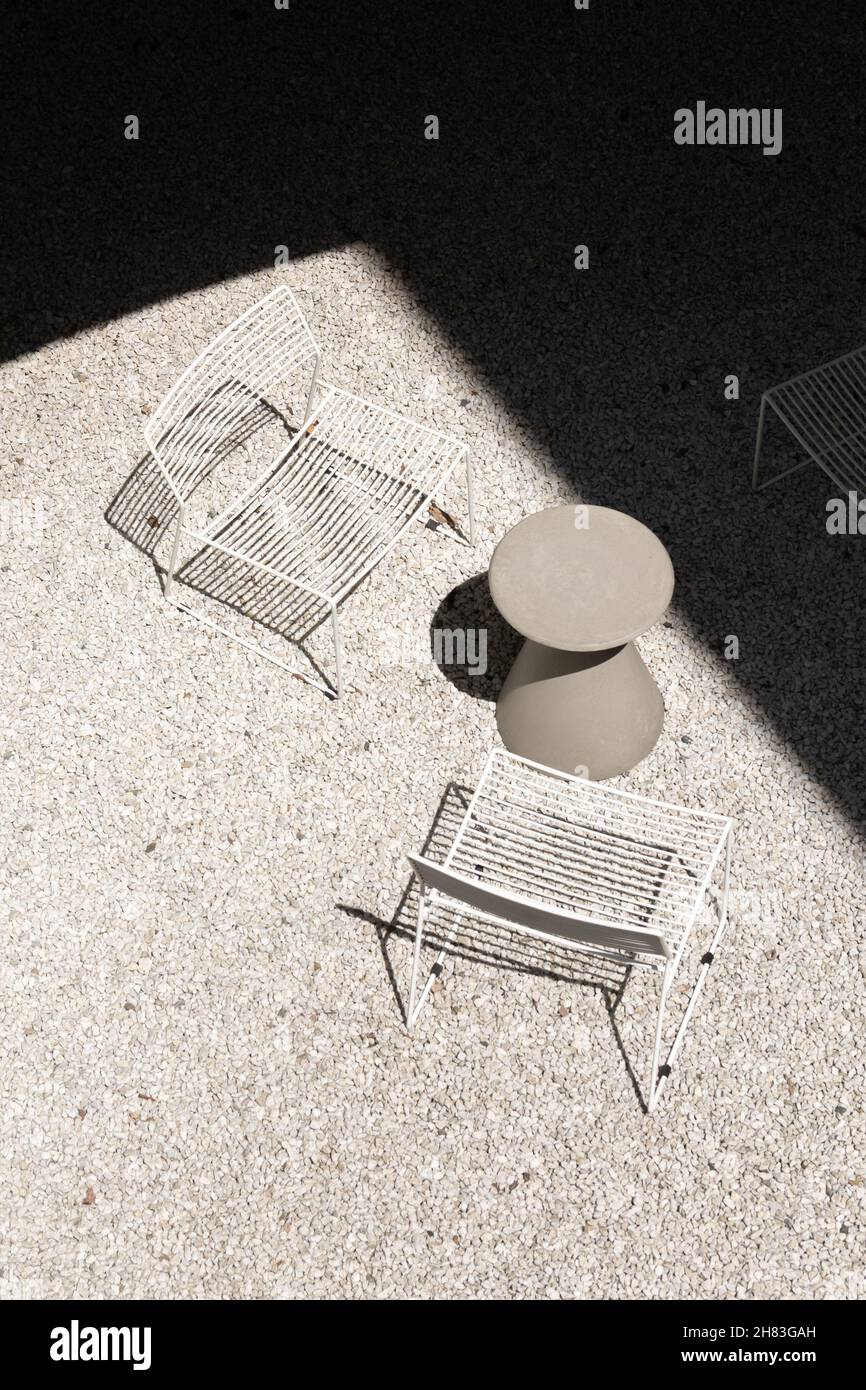 photography of outdoor interiors with modern table and benches and play ...