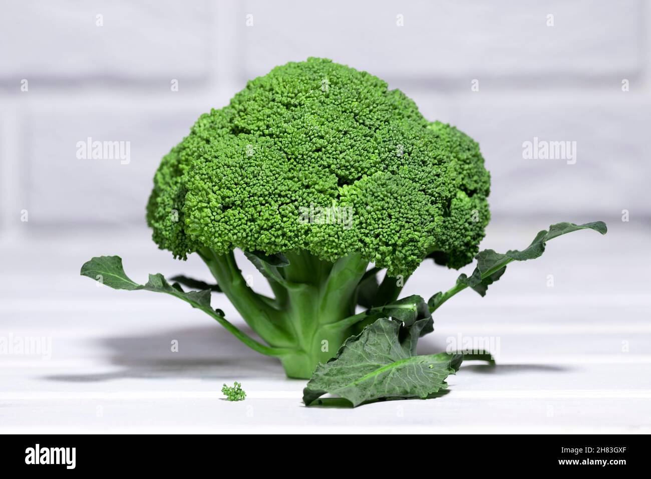 Raw green broccoli on white background, healhy eating diet Stock Photo ...